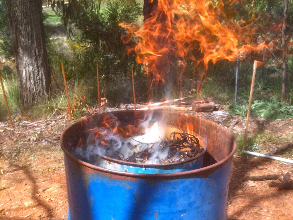 Making Biochar: Building Our First Dome School Biochar Stove - Milkwood ...